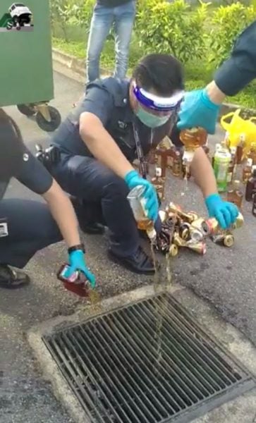 Auxiliary Police Officers Pour Alcohol Away In Tuas Dorm, Security ...