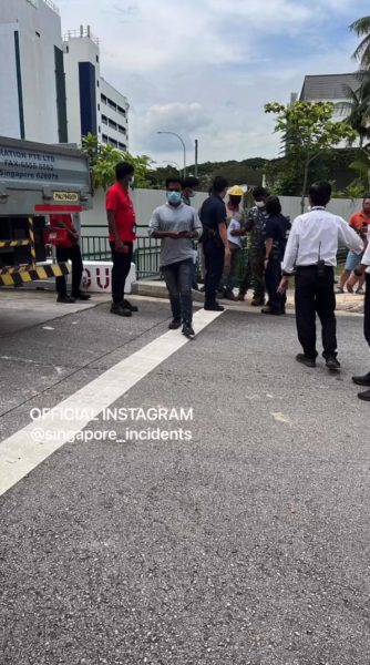9 Men Stand Outside AMK Building Holding Signs Demanding Salaries ...
