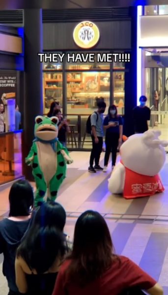 Saluting Frog Mascot Chases Mixue Snowman At Paya Lebar Square, Latter ...