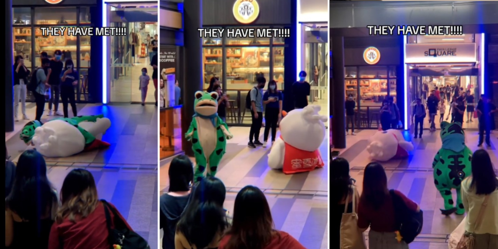Saluting Frog Mascot Chases Mixue Snowman At Paya Lebar Square, Latter ...