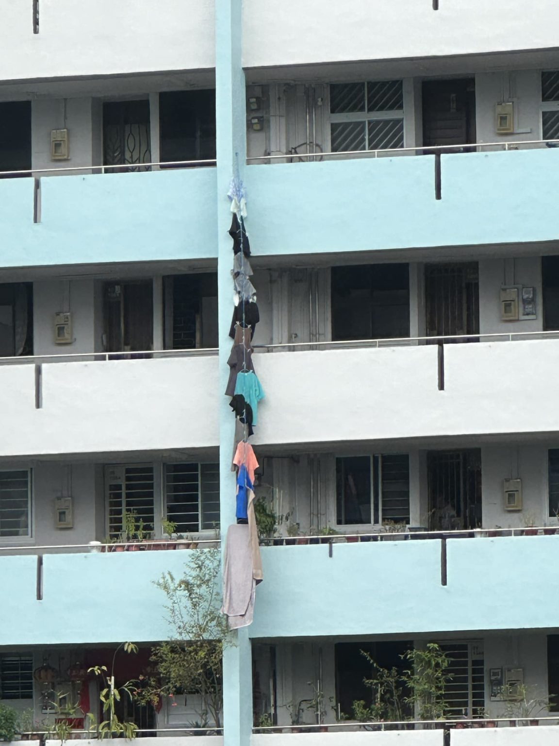 Resident Hangs Clothes Vertically Down HDB Parapet, Looks Like An ...