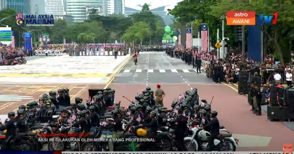 Female Soldier Rides Motorcycle Over 66 Bikes In Thrilling Stunt For M'sia's National Day