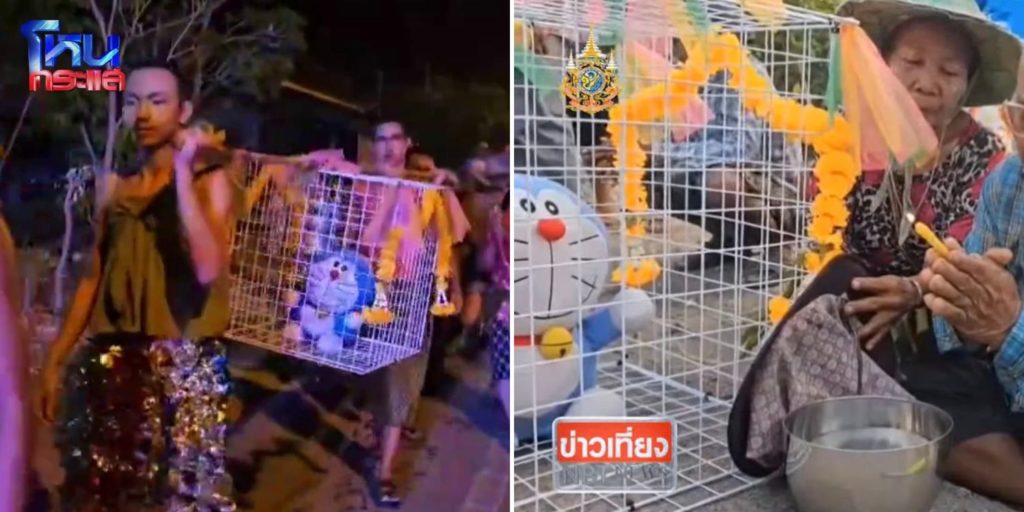 Thai villagers cage Doraemon soft toy as part of rain-making ritual