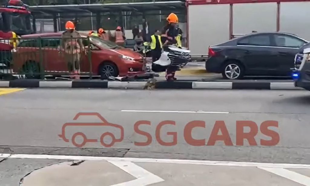 Car crashes into Simei bus stop after going through road divider ...