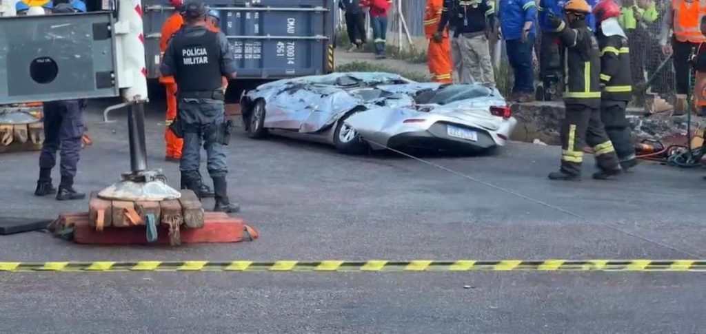 Car in Brazil flattened after container truck overturns, driver killed