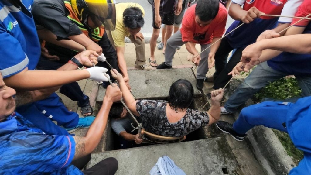 Woman falls into manhole in Thailand, spends 30 minutes in sewage ...