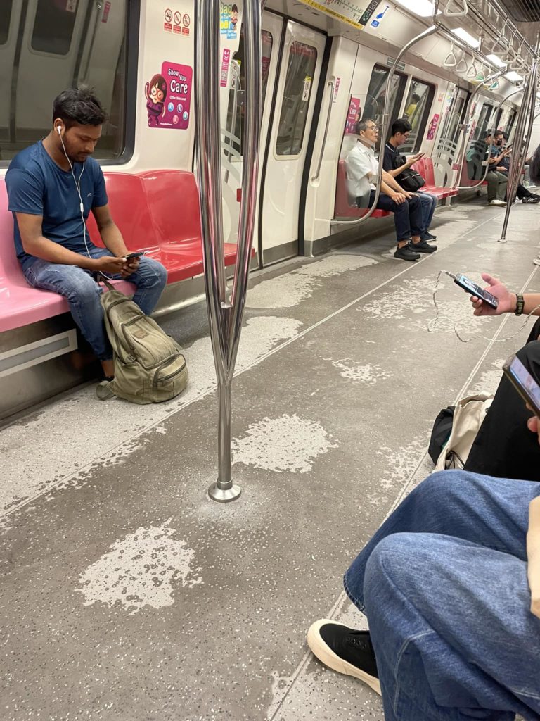 SMRT workers restore 'spotty' train flooring, surfaces are scrubbed clean