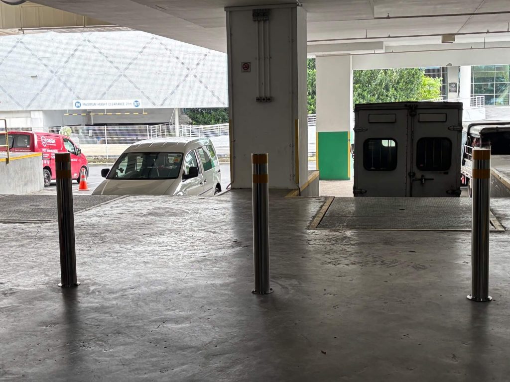 2 vehicles plunge into loading bay at Ubi car park due to confusing ...