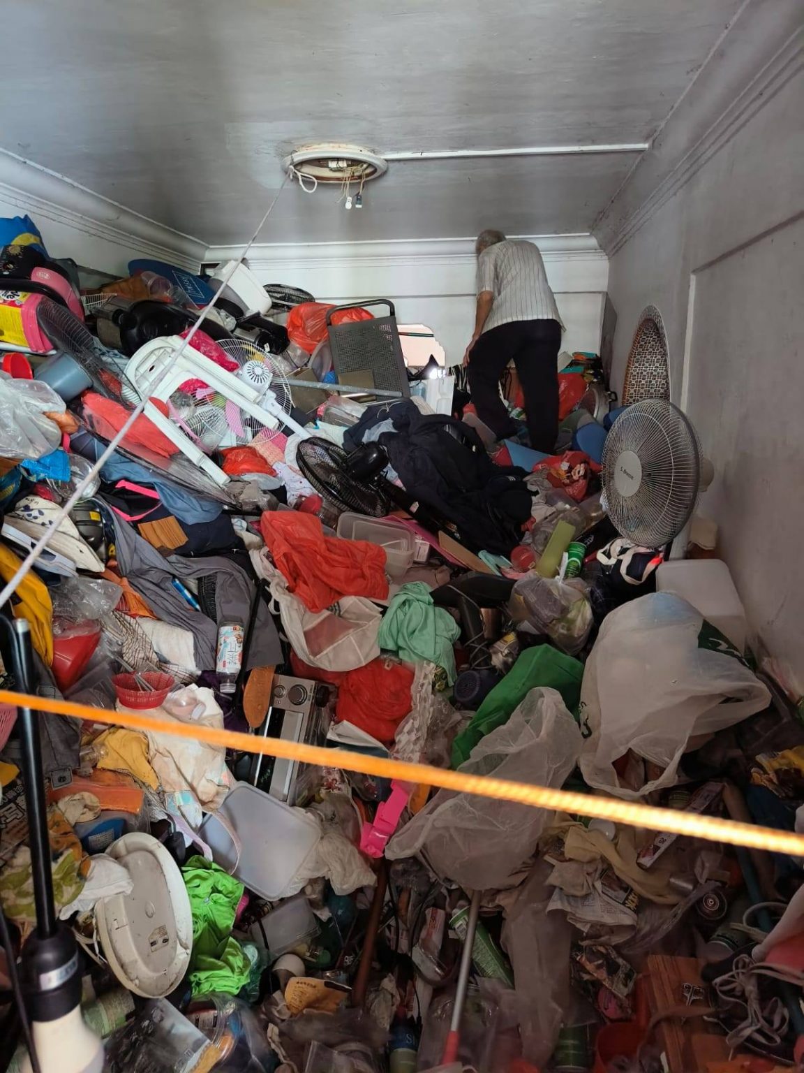 Elderly hoarder lives alone in heavily cluttered Bedok Reservoir flat ...