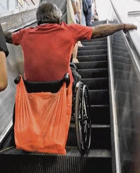 Elderly man seen taking Bugis MRT escalator in wheelchair, sparks ...