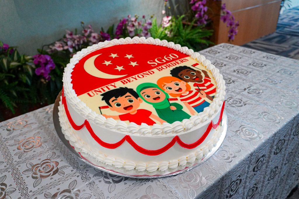 ICA presented with SG60 cake from M'sia for National Day, comes with ...