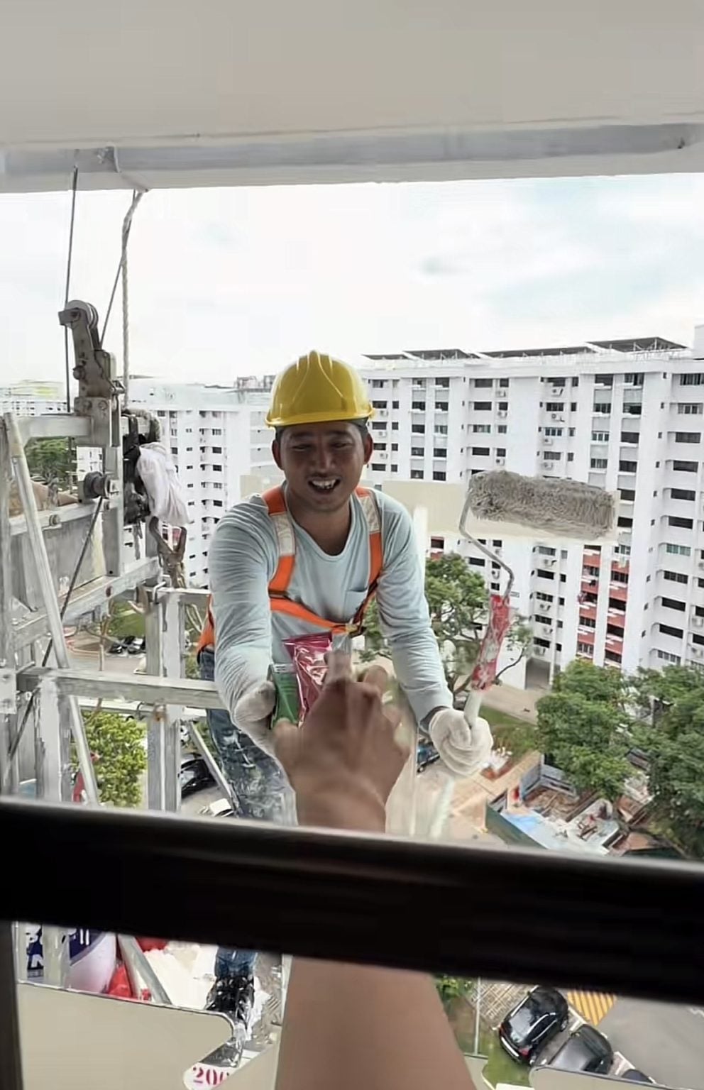 Man hands nasi lemak & cigarettes to workers painting Bedok HDB block ...