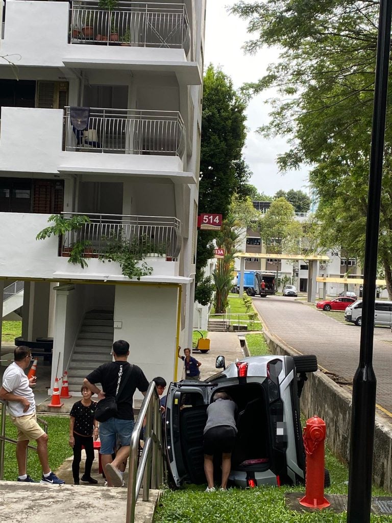 2 suffer minor injuries after car flips on its side near Bedok North ...